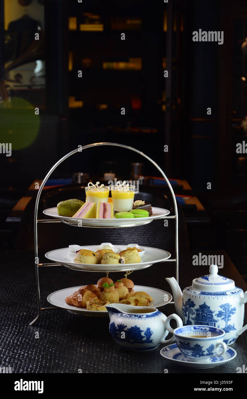 Scone and macaroon with sweet sauce afternoon tea set Stock Photo - Alamy