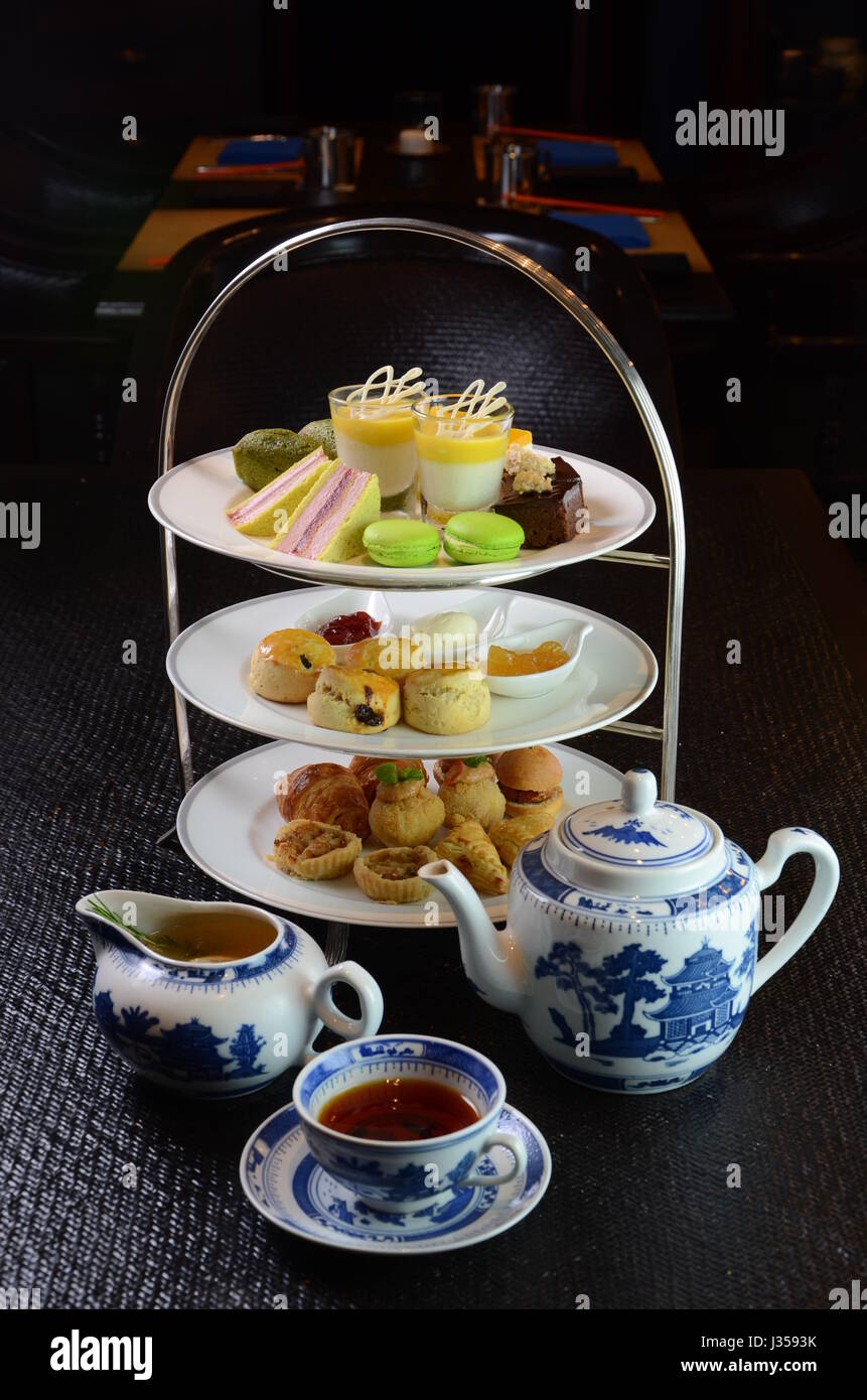 Scone and macaroon with sweet sauce afternoon tea set Stock Photo - Alamy