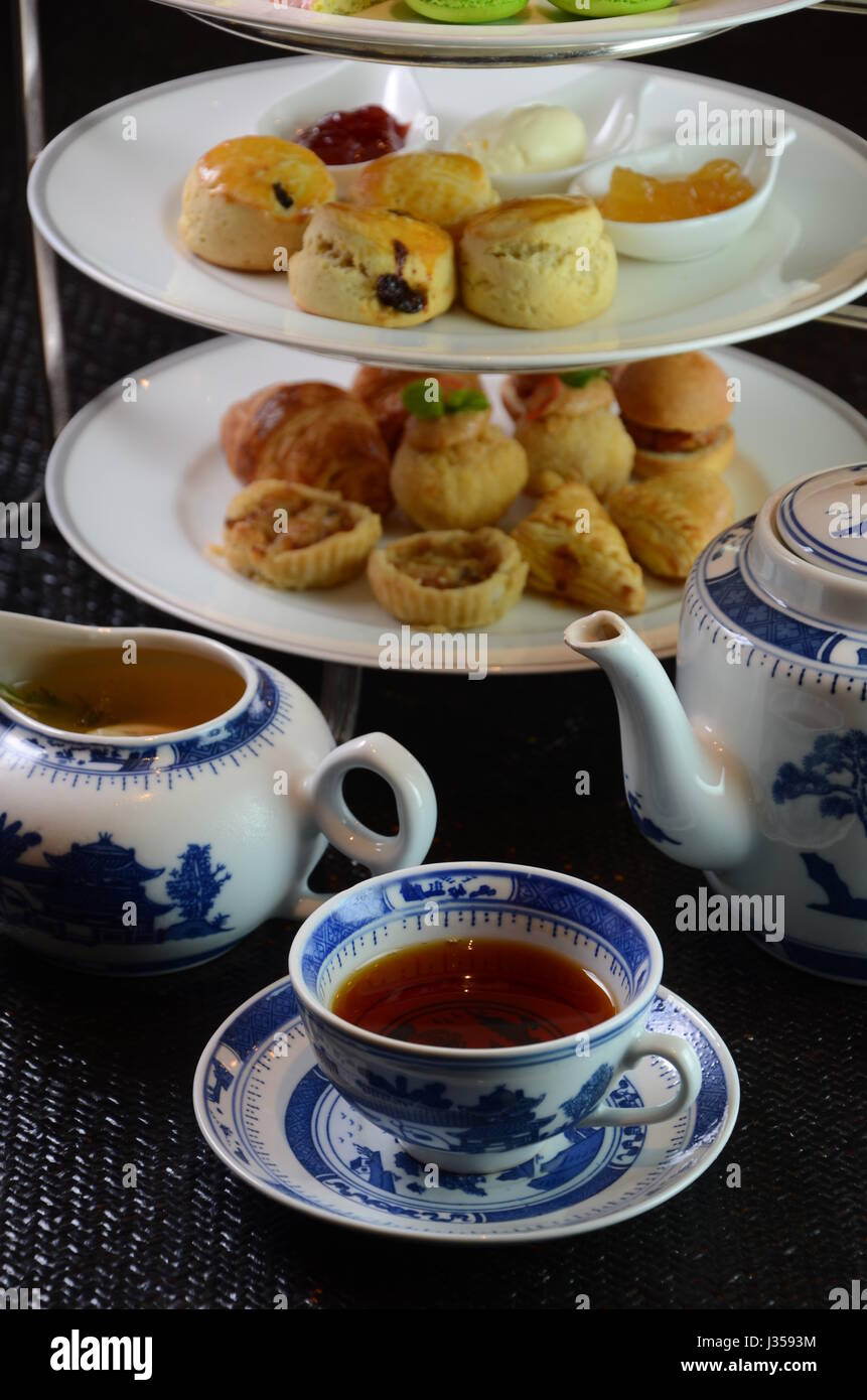 Scone and macaroon with sweet sauce afternoon tea set Stock Photo - Alamy