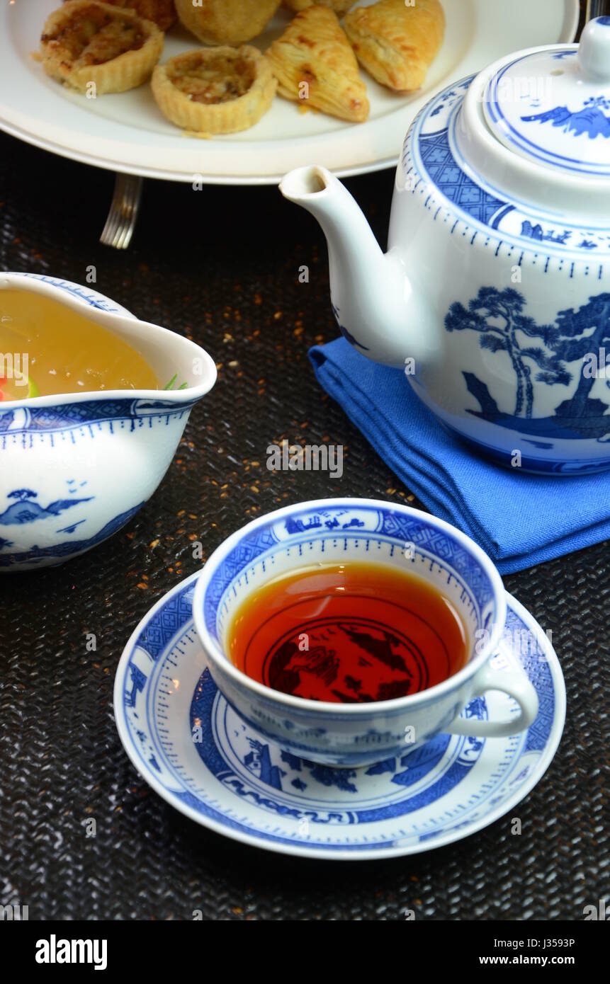Scone and macaroon with sweet sauce afternoon tea set Stock Photo - Alamy