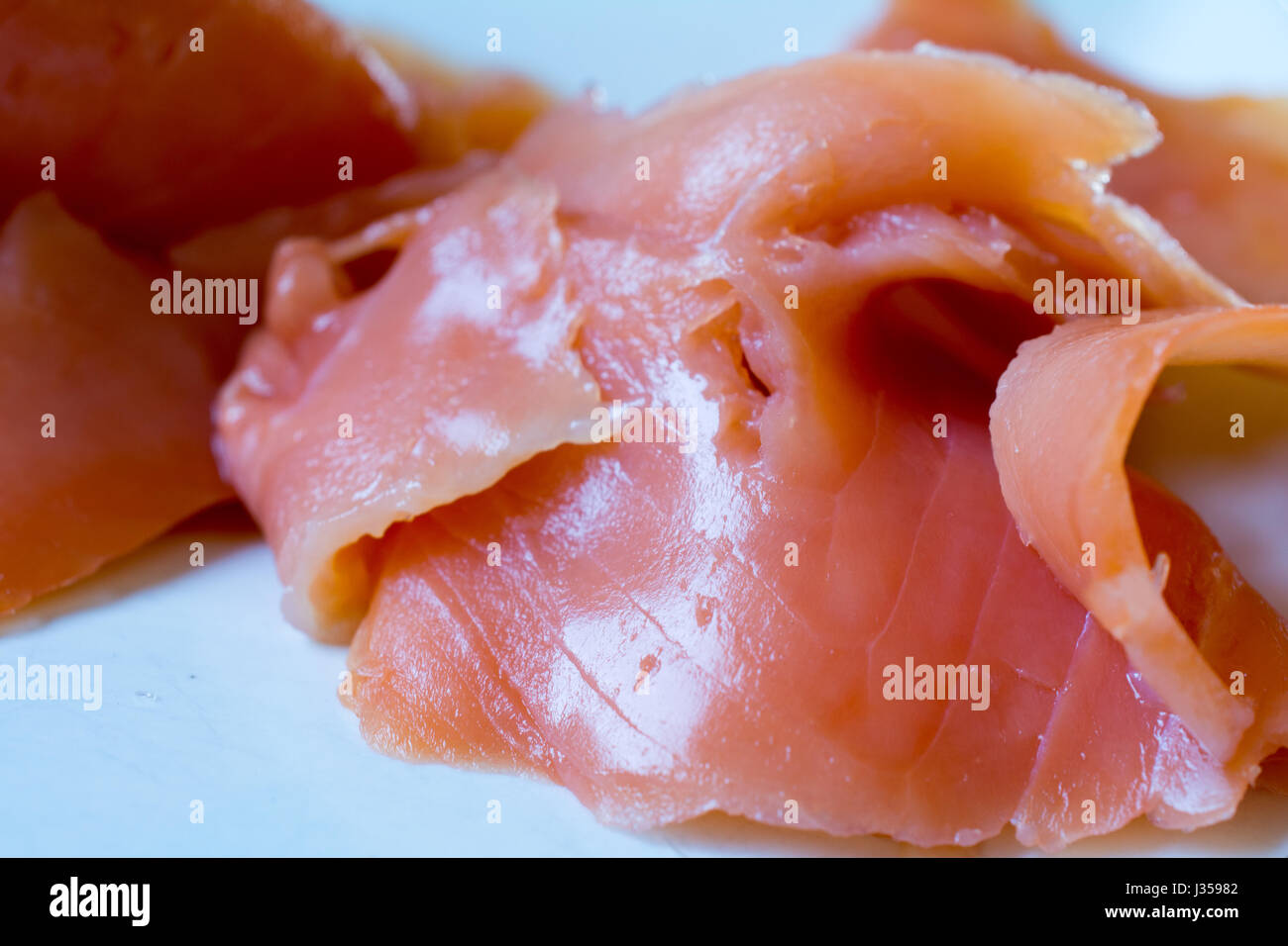 Smoked salmon slice close up Stock Photo - Alamy