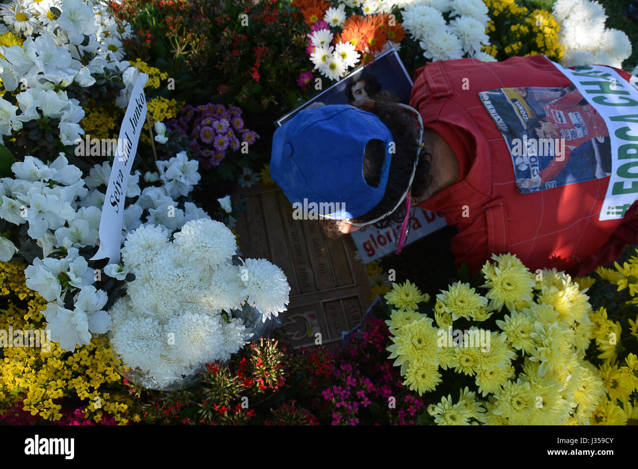 Fans visit the tomb of pilot Ayrton Senna at the . Today completes 23 ...