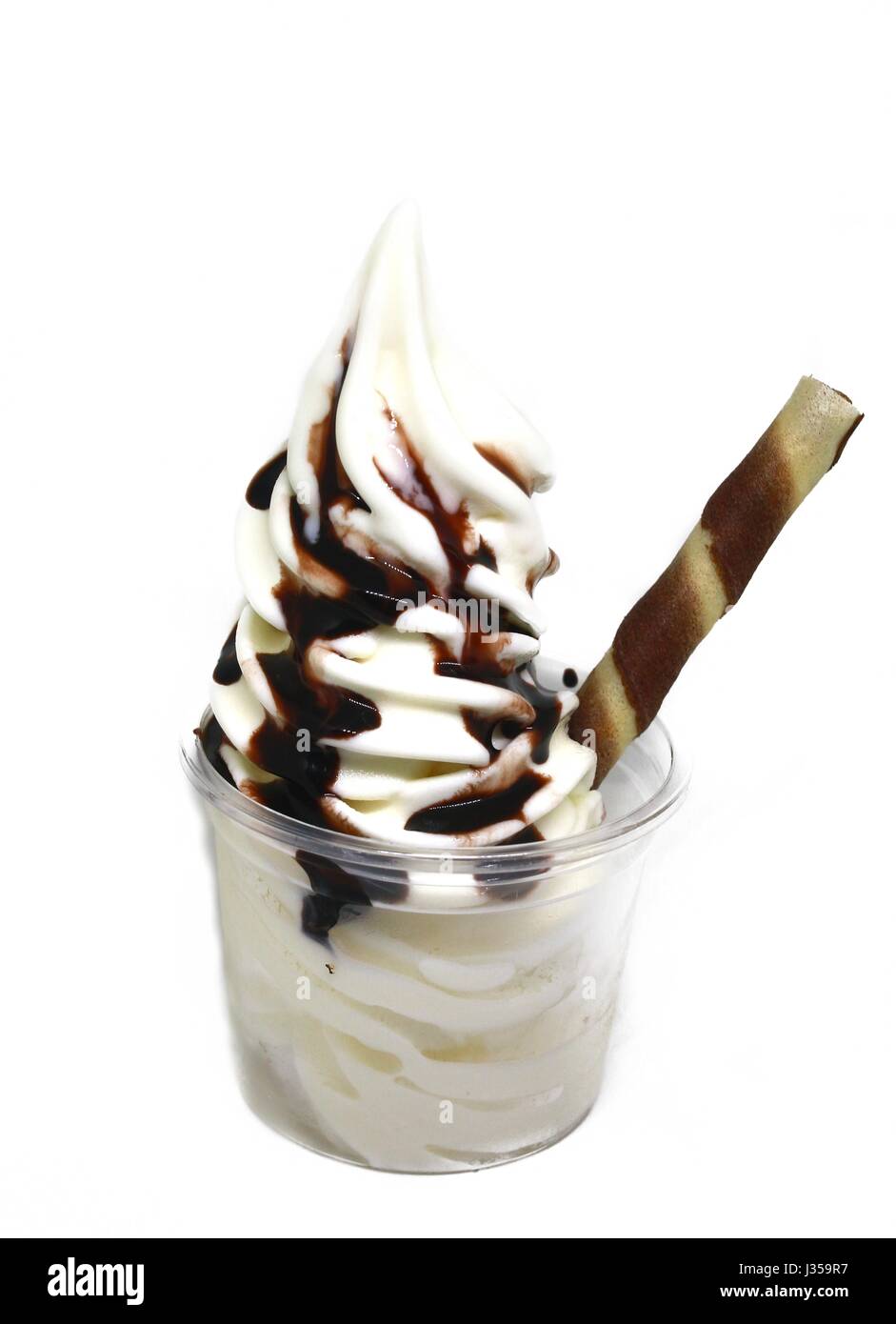 soft serve ice cream in a cup with topping Stock Photo - Alamy