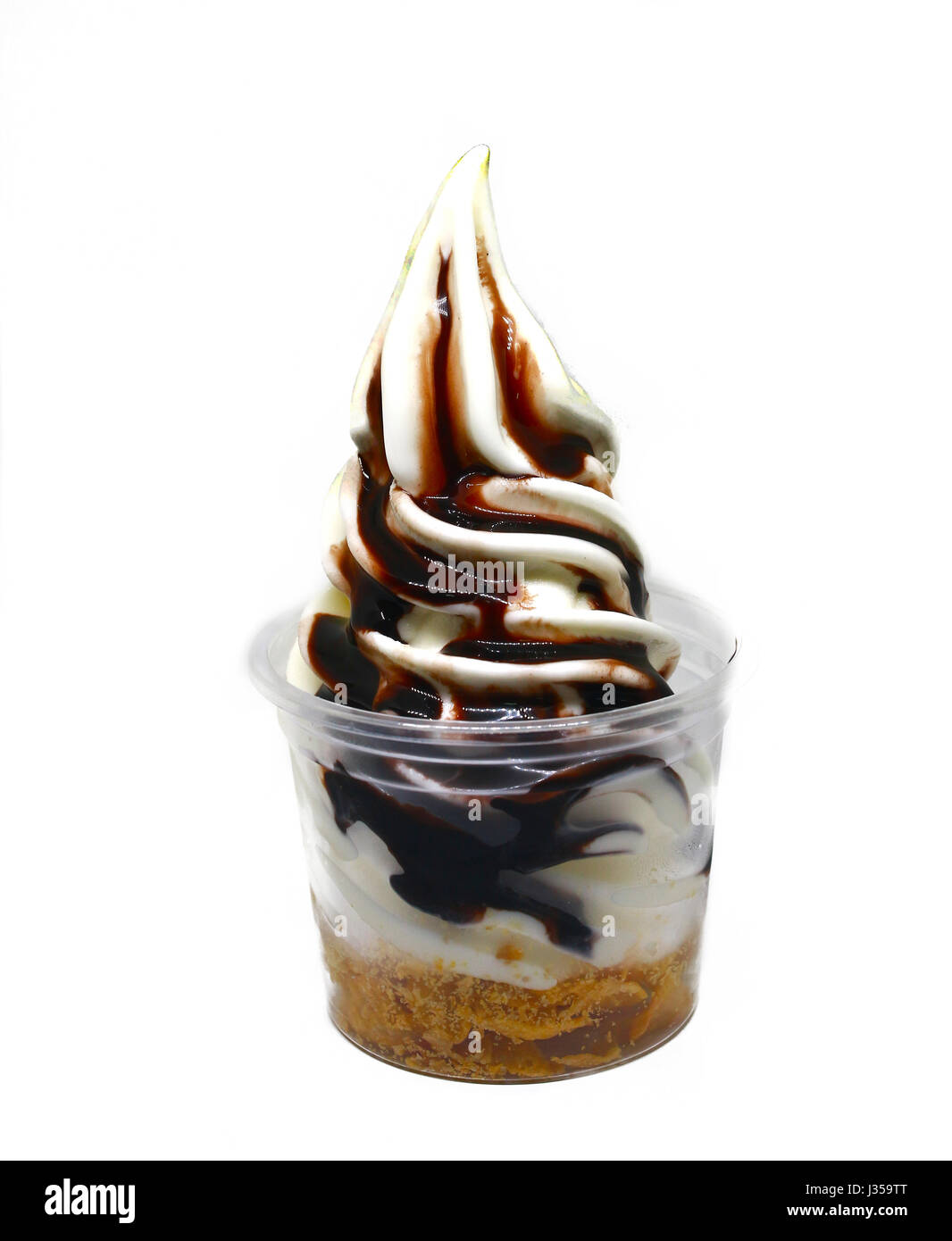 soft serve ice cream in a cup with topping Stock Photo - Alamy