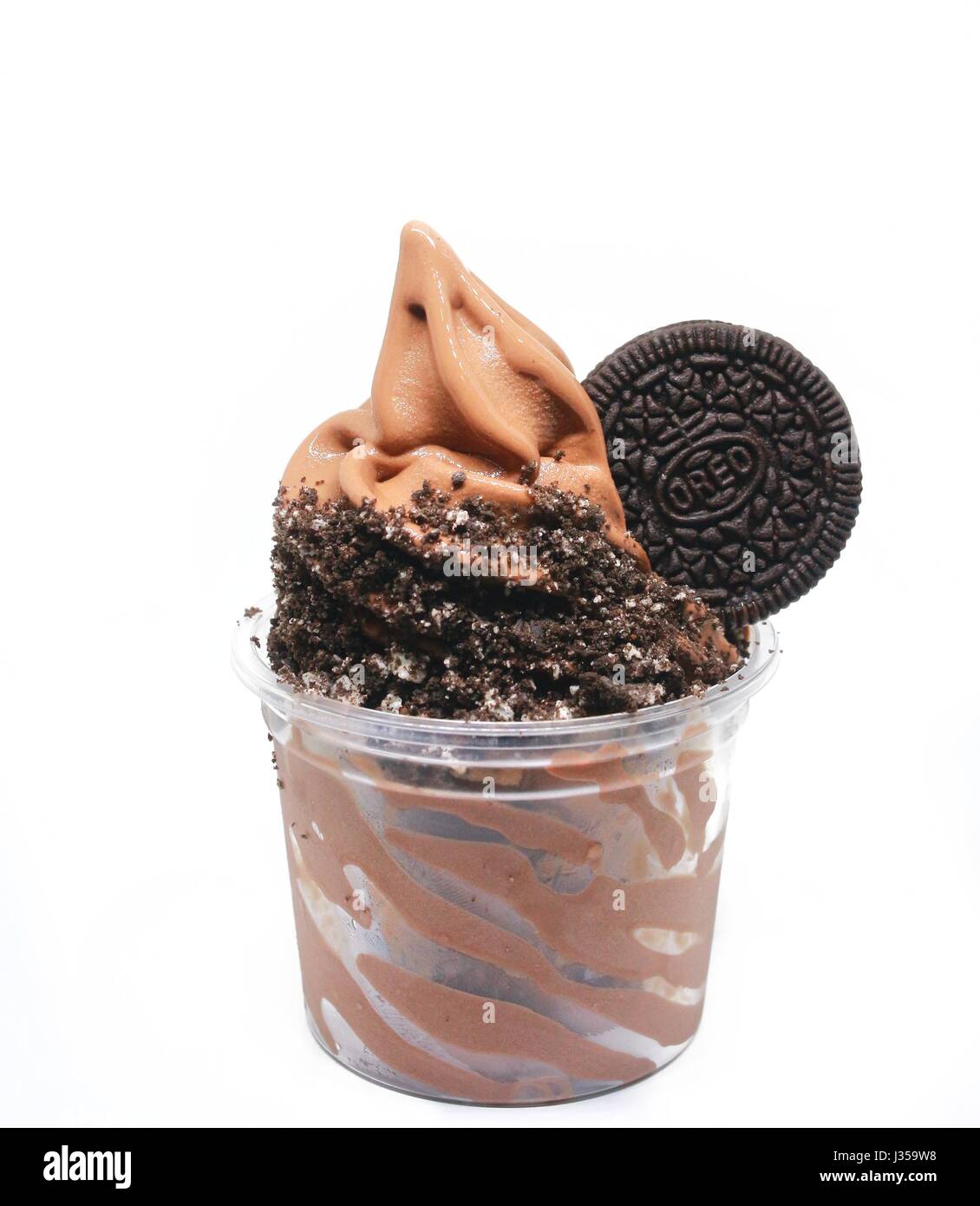 soft serve ice cream in a cup with topping Stock Photo - Alamy