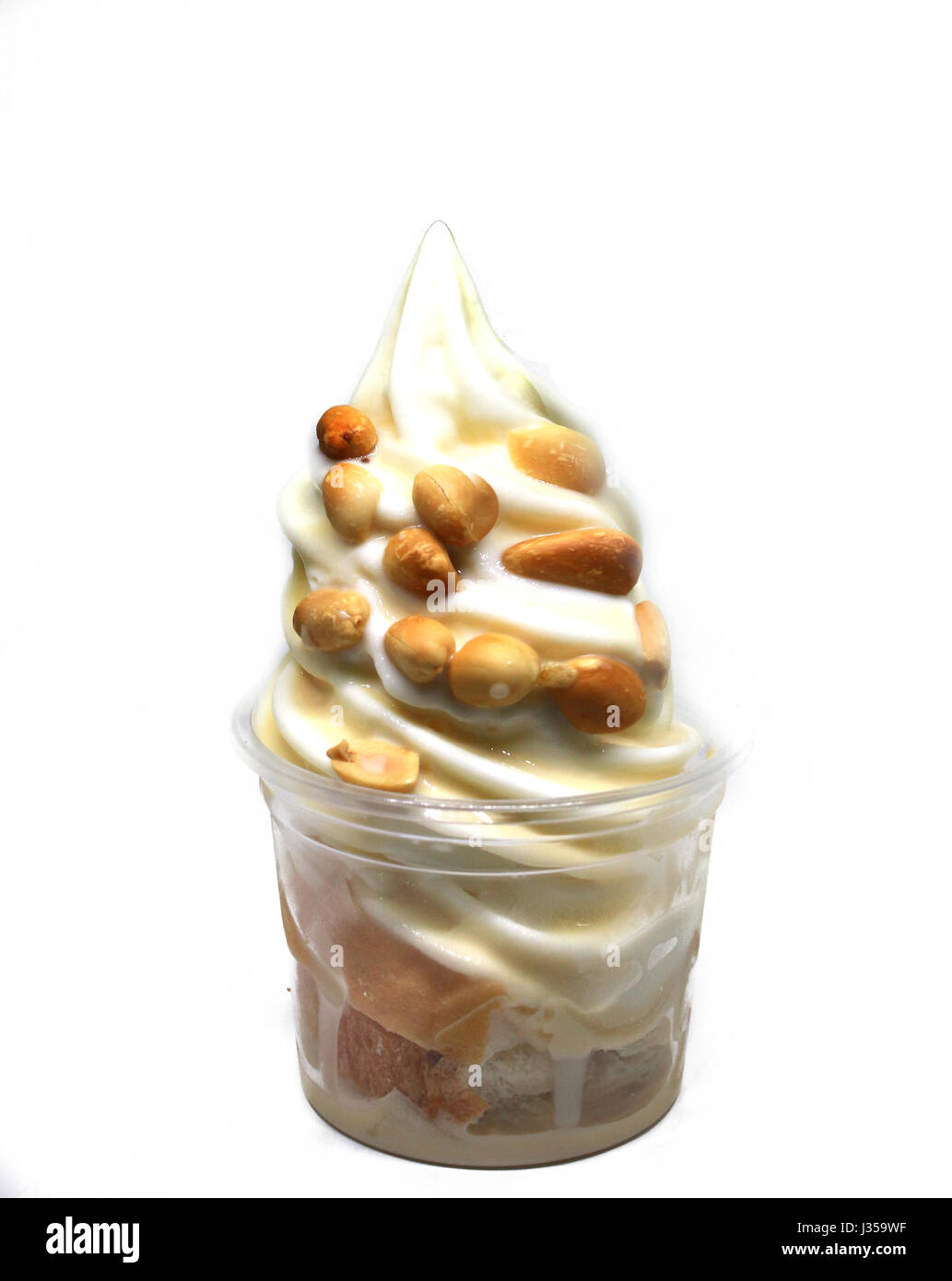 soft serve ice cream in a cup with topping Stock Photo - Alamy