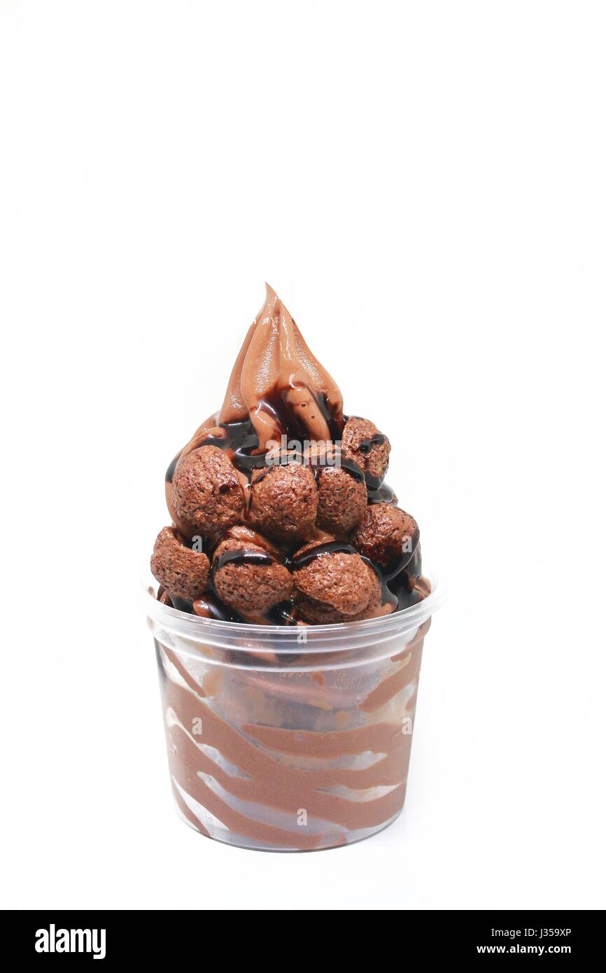 soft serve ice cream in a cup with topping Stock Photo - Alamy