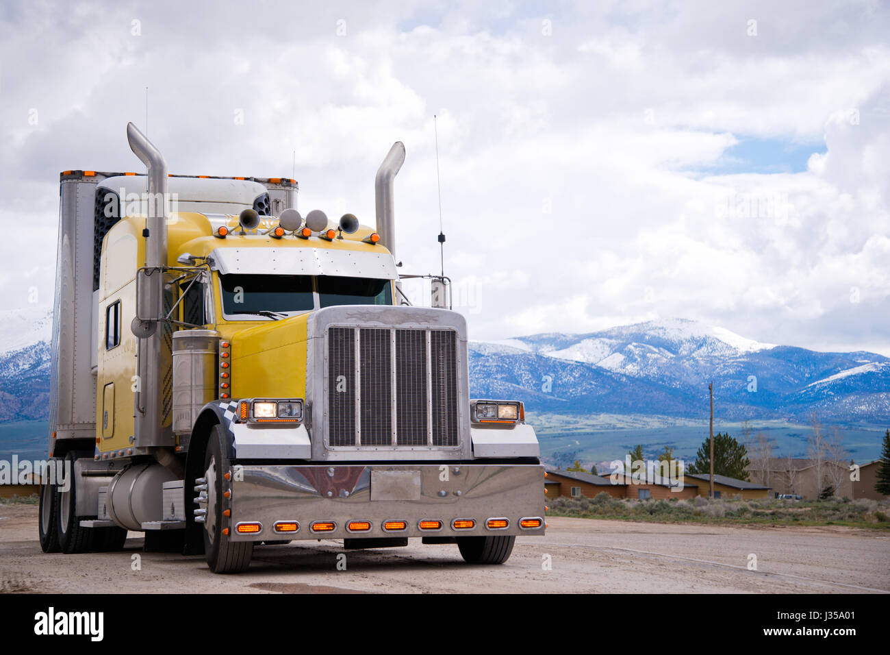 Powerful yellow classic popular professional American bonneted big rig ...