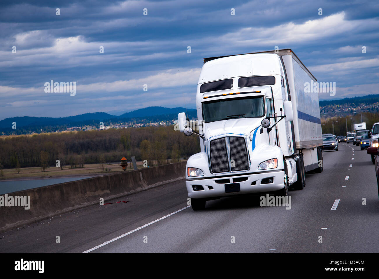 Elegant powerful semi truck with the windows on high cab for long ...