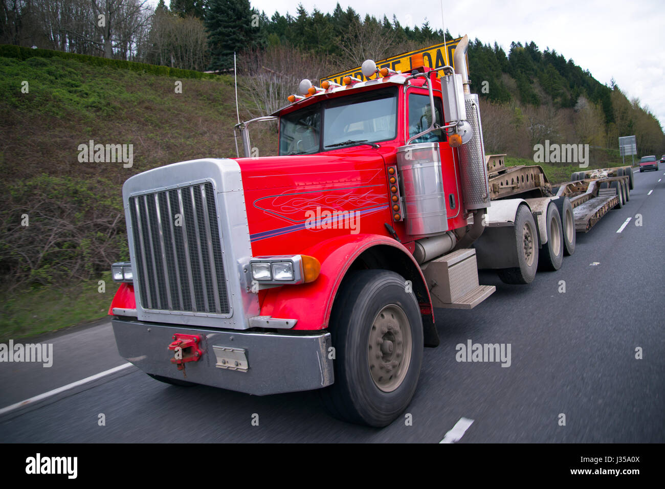 Super powerful American red color semi truck with flat bed step down ...