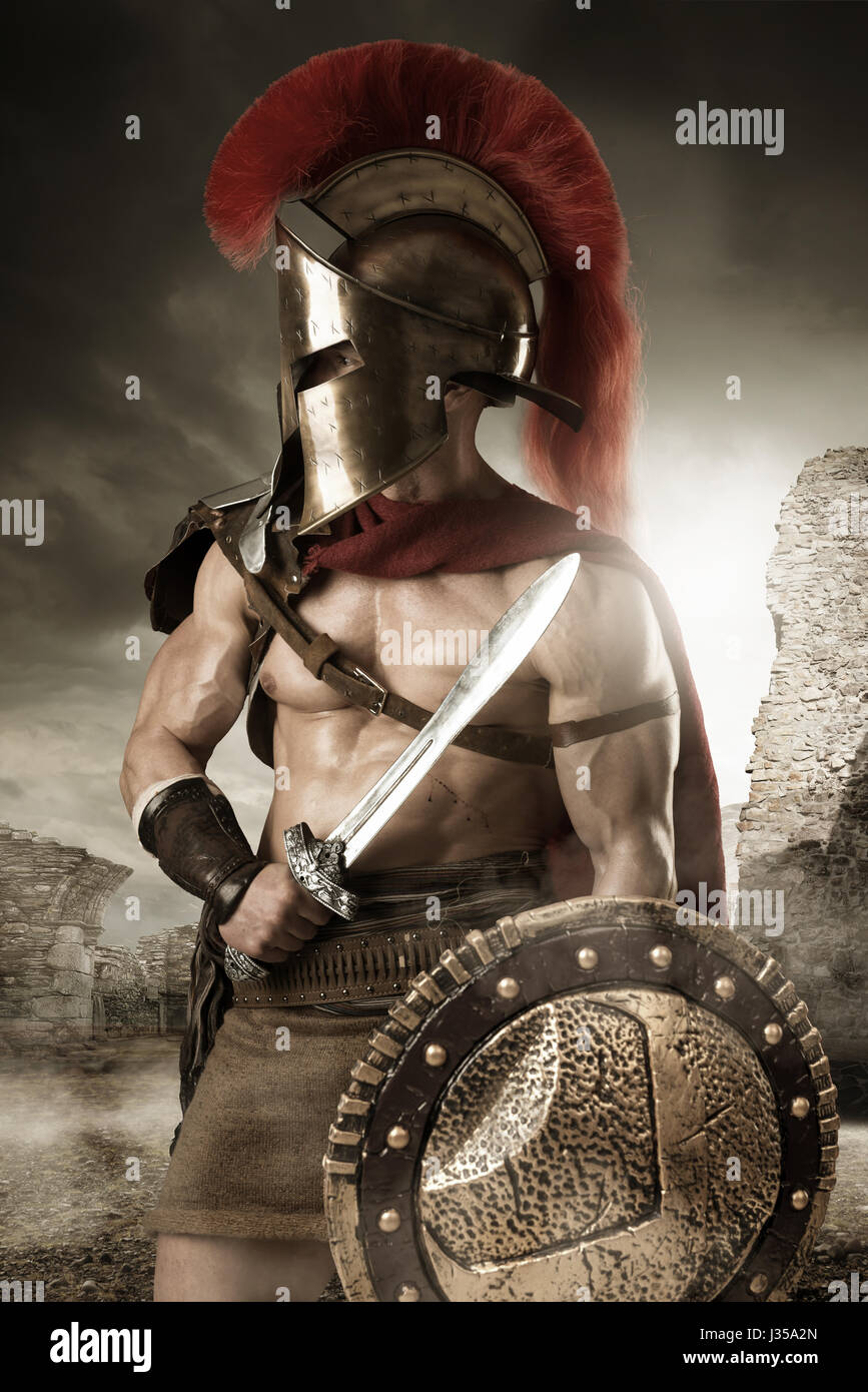 Ancient warrior or Gladiator posing outdoors with helmet Stock Photo ...