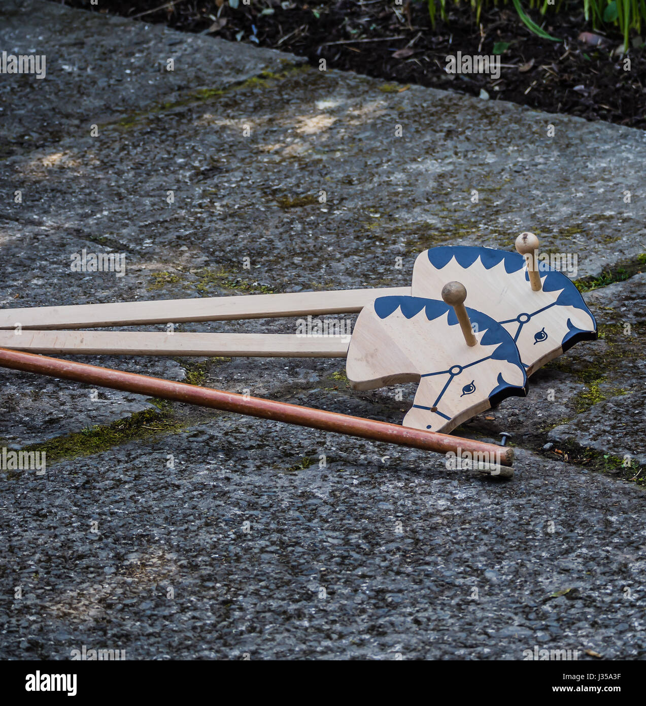 Girl riding stick horse hi-res stock photography and images - Alamy