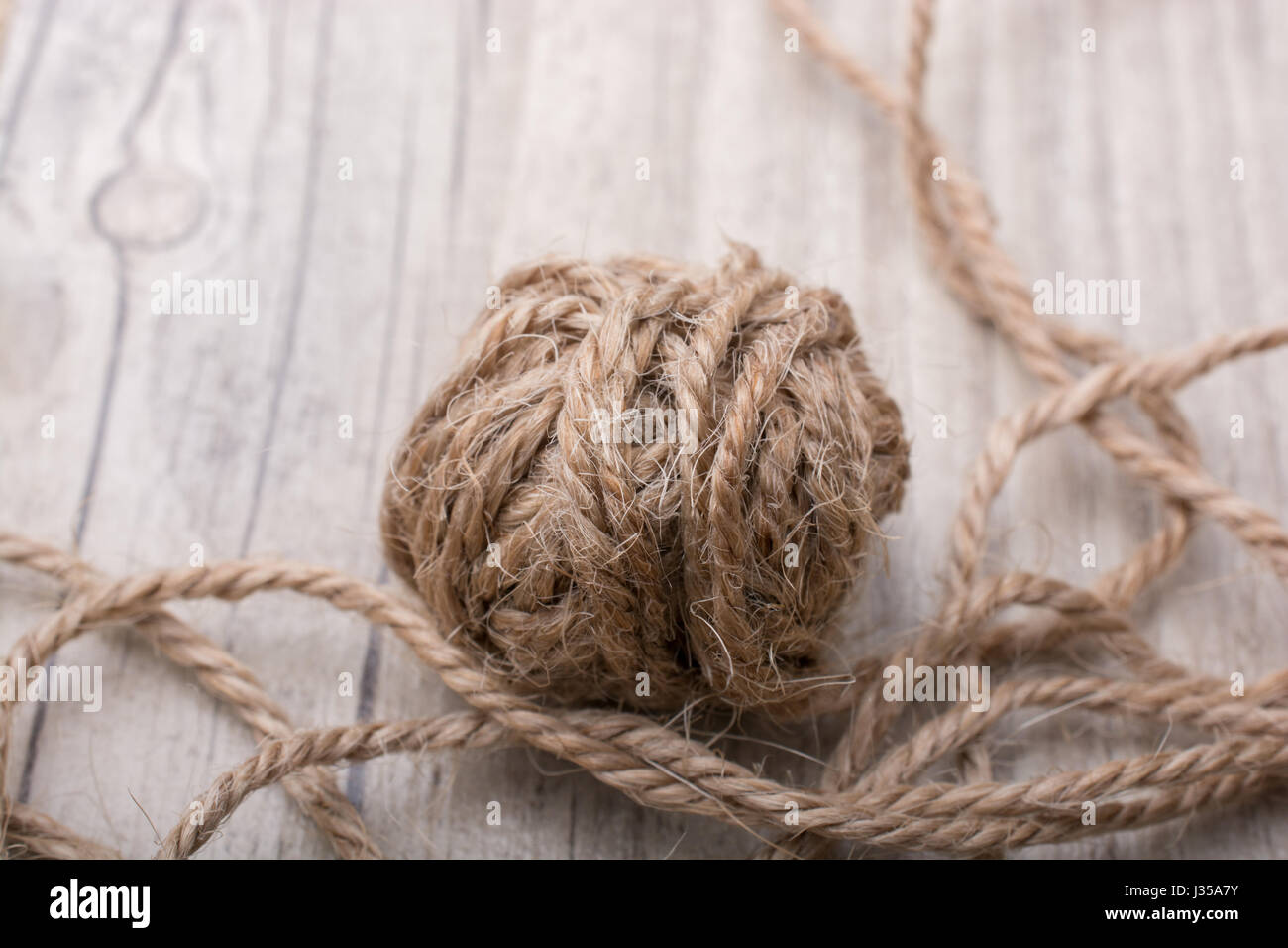 Roll of brown color linen string on grey background Stock Photo - Alamy
