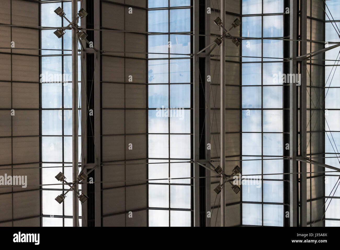 Roof structure of big hall with windows and blue sky Stock Photo - Alamy