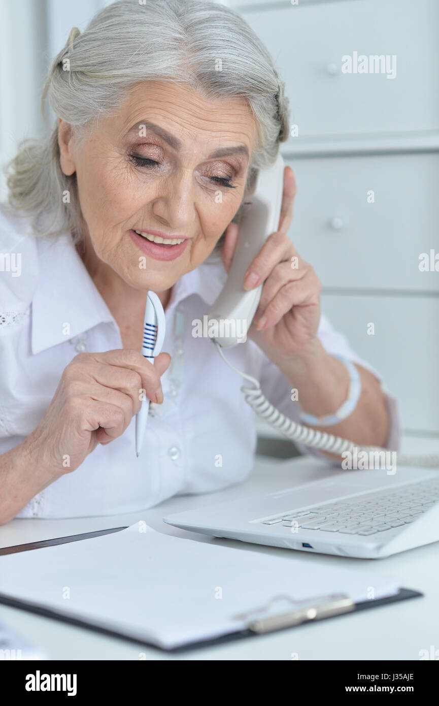 Elderly businesswoman working Stock Photo - Alamy