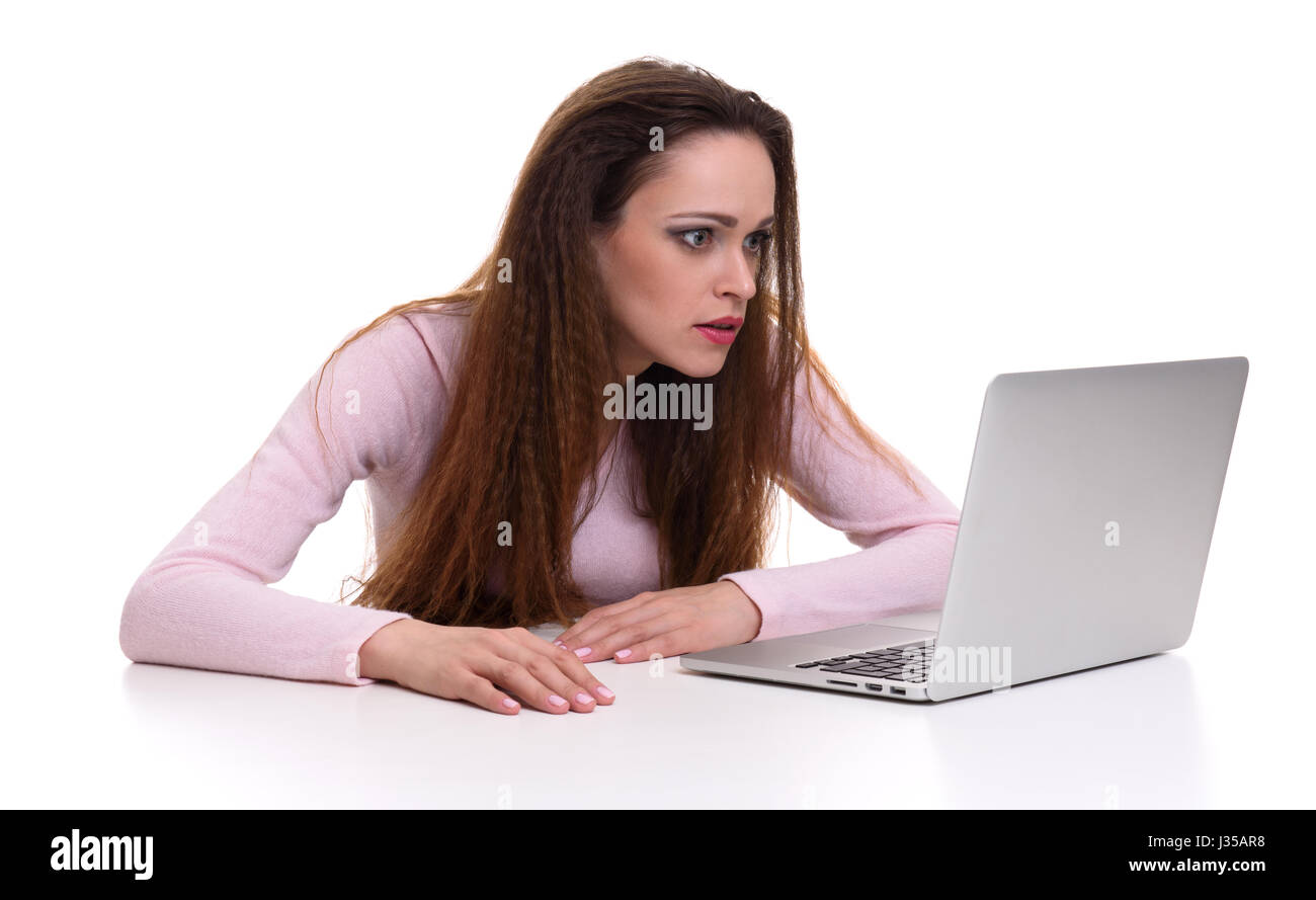 woman looking at her laptop. Isolated on white background Stock Photo ...