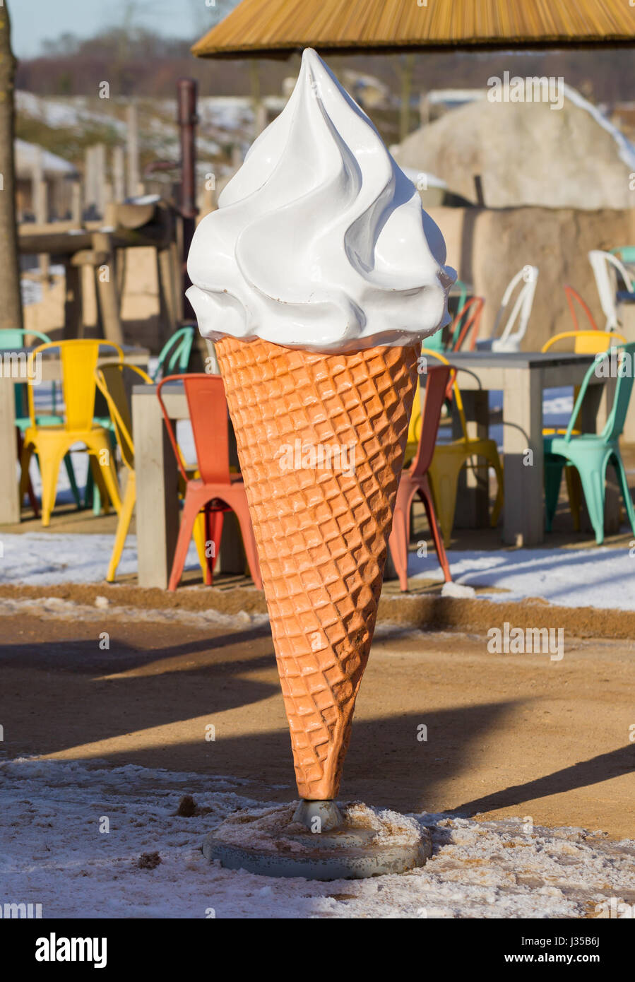 Ice cream cone in front of an ice cream bar Stock Photo - Alamy