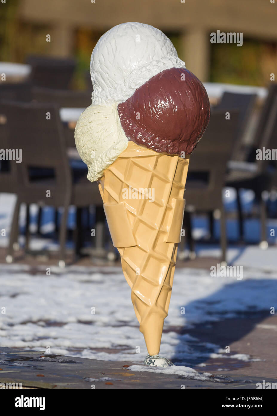 Ice cream cone in front of an ice cream bar Stock Photo - Alamy