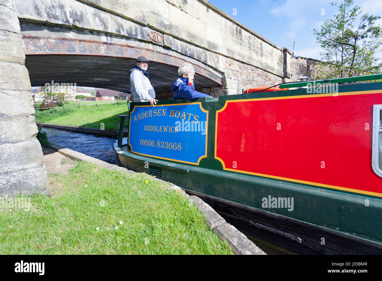 People coming through a bridge into Trevor Basin on the Llangollen ...