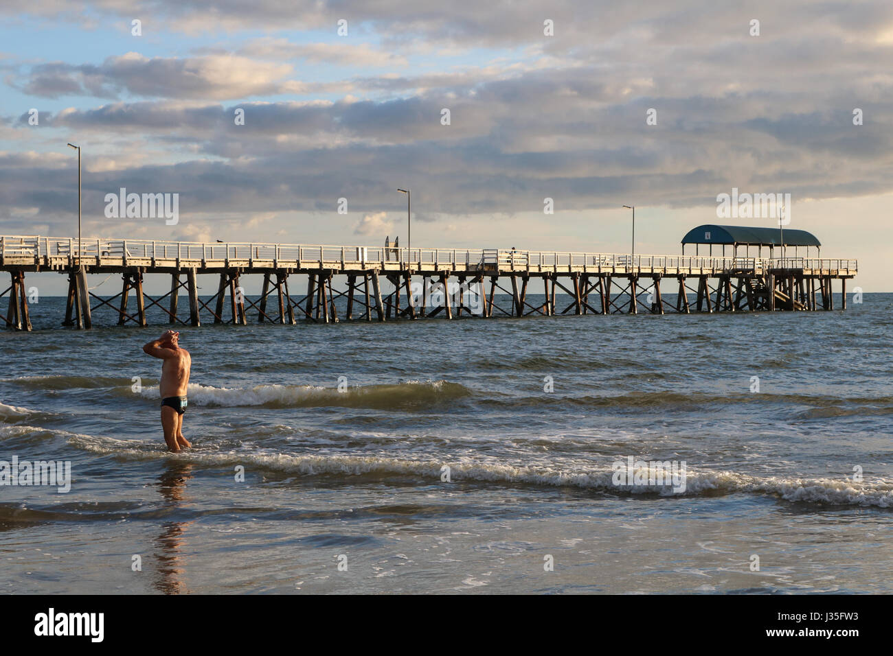 Adelaide, Australia. 3rd May, 2017. A man swims in the sea during ...