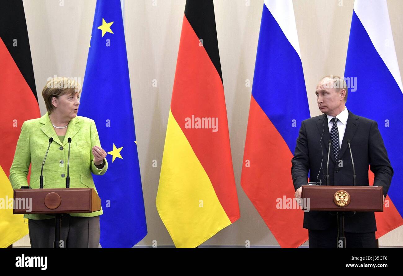 Russian President Vladimir Putin and German Chancellor Angela Merkel ...