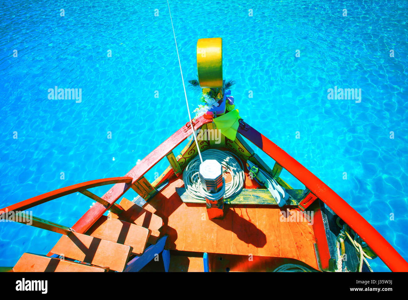 colorful of wood boat against beautiful clear blue sea water with clear ...