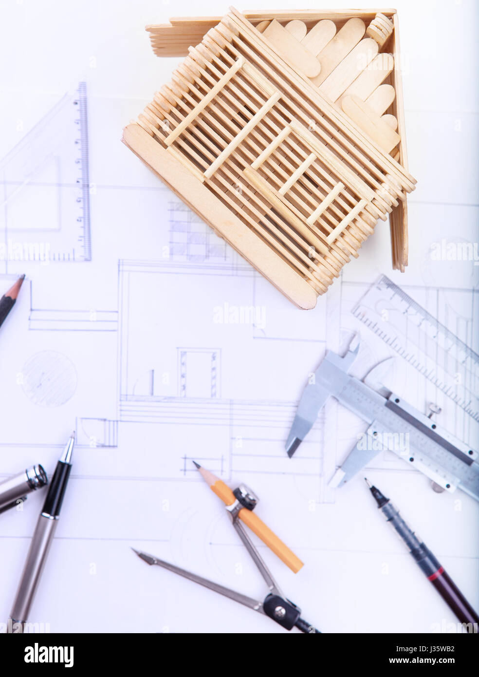 architect working table with plan home model and writing instrument and ...