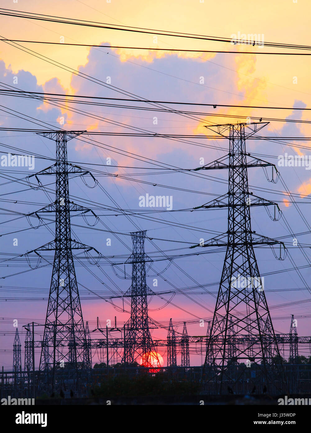 beautiful sunset behind electricity plant industry estate use as ...