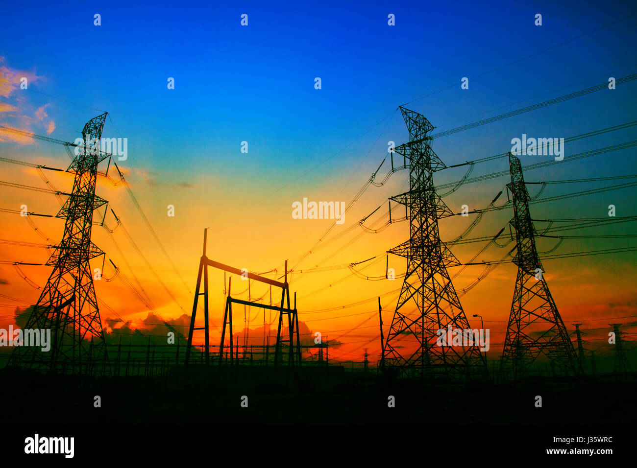 beautiful sunset behind electricity plant industry estate use as ...