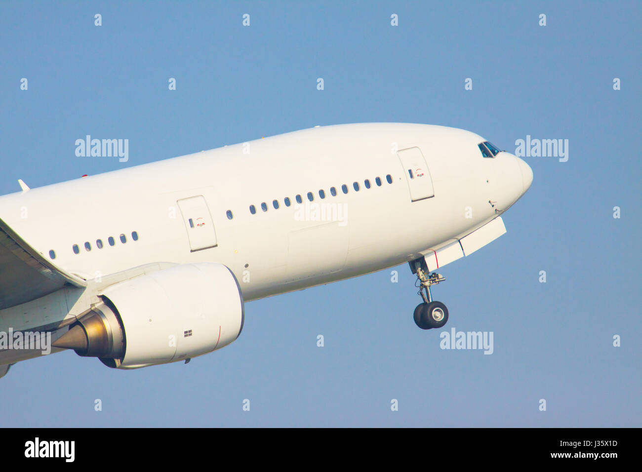 zoom up front veiw of passenger jet plane take off to flying from ...