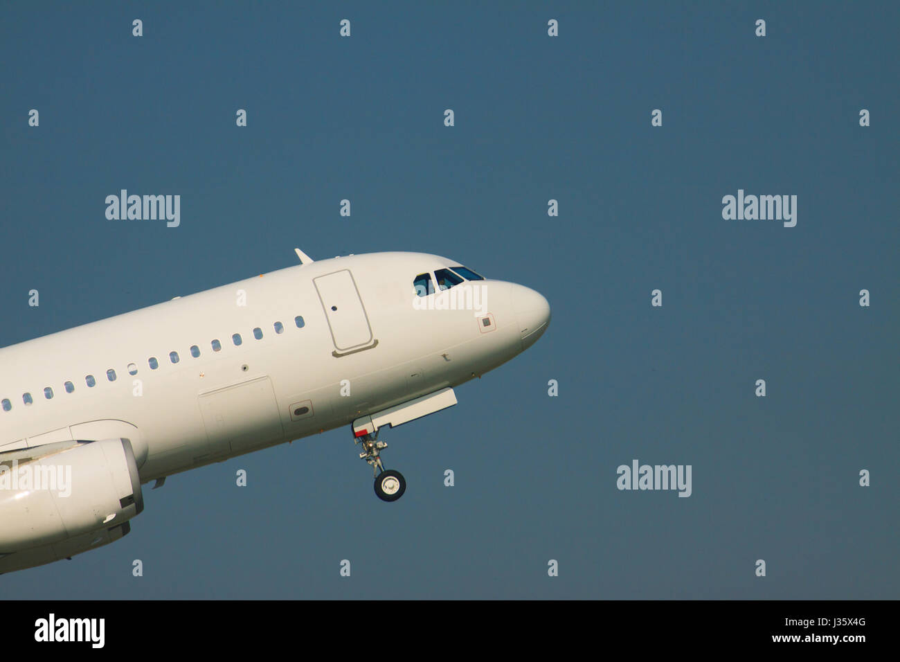 zoom up front veiw of passenger jet plane take off to flying from ...