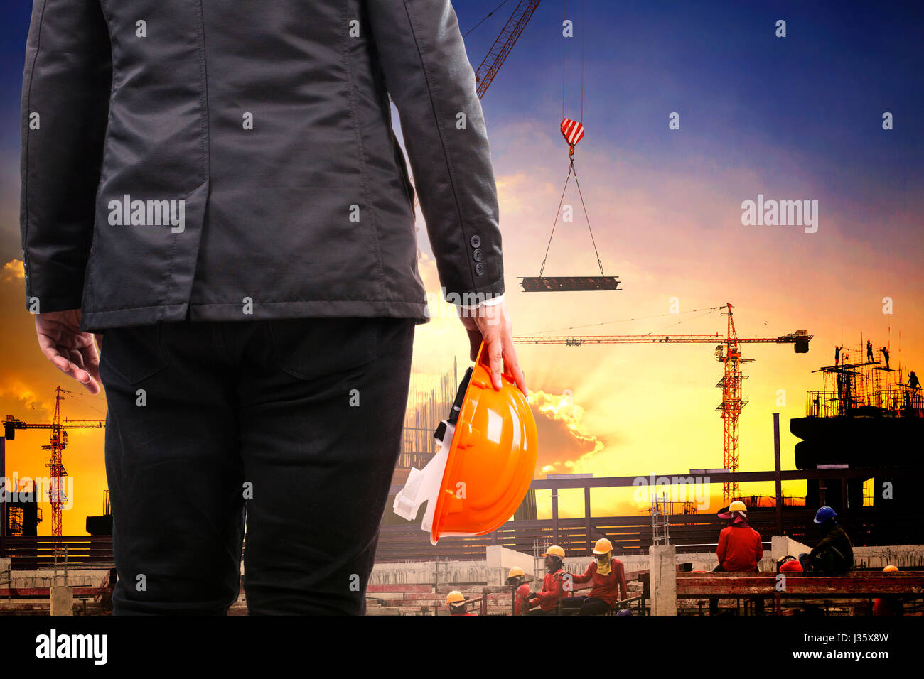 engineering man holding safety helmet and working in building ...
