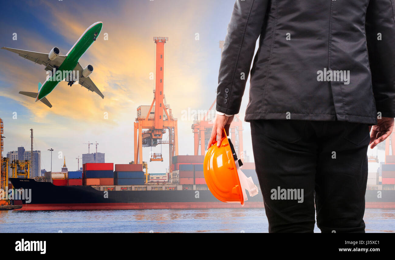 working man on duty in container ship port corgo logistic use for ...