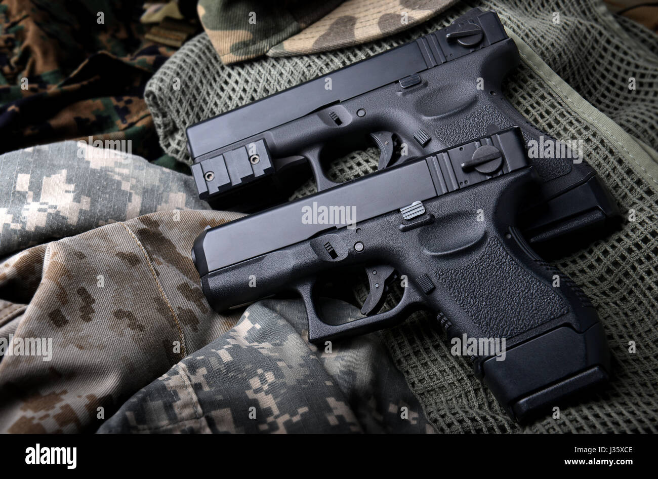 Pistal automatic short hand gun in the US army prop background photo in ...