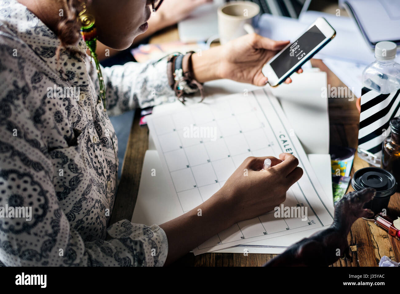 Woman writing on calendar hi-res stock photography and images - Alamy