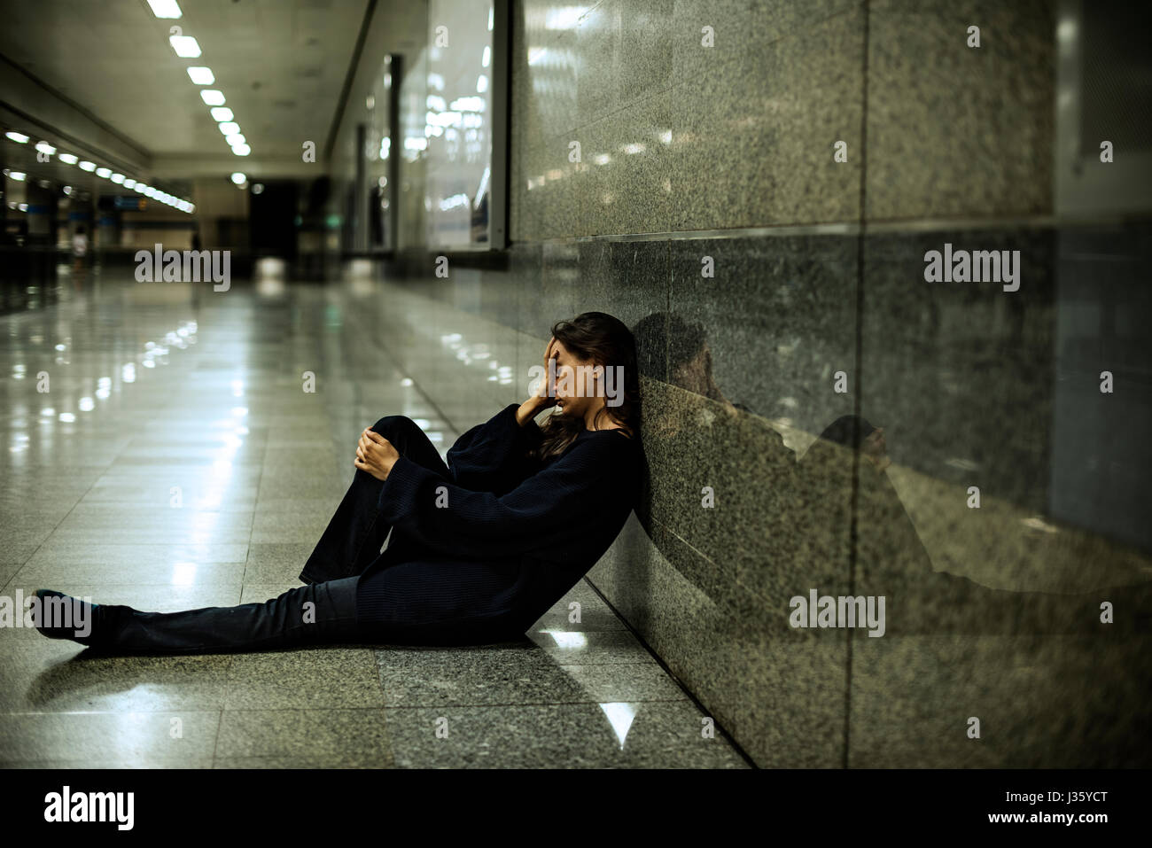 Hopeless person sitting on floor hi-res stock photography and images ...