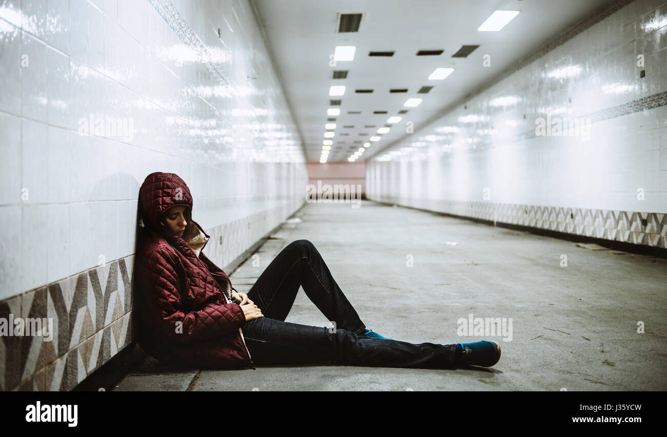 Hopeless person sitting on floor hi-res stock photography and images ...
