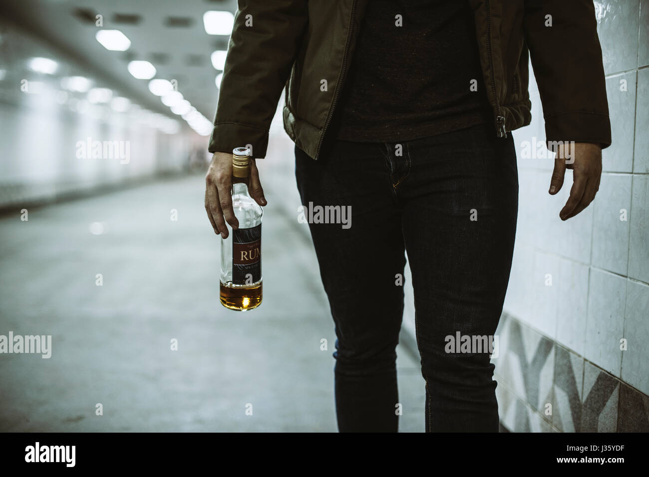 Homeless Alcoholism Woman Holding Liquor Bottle Stock Photo - Alamy