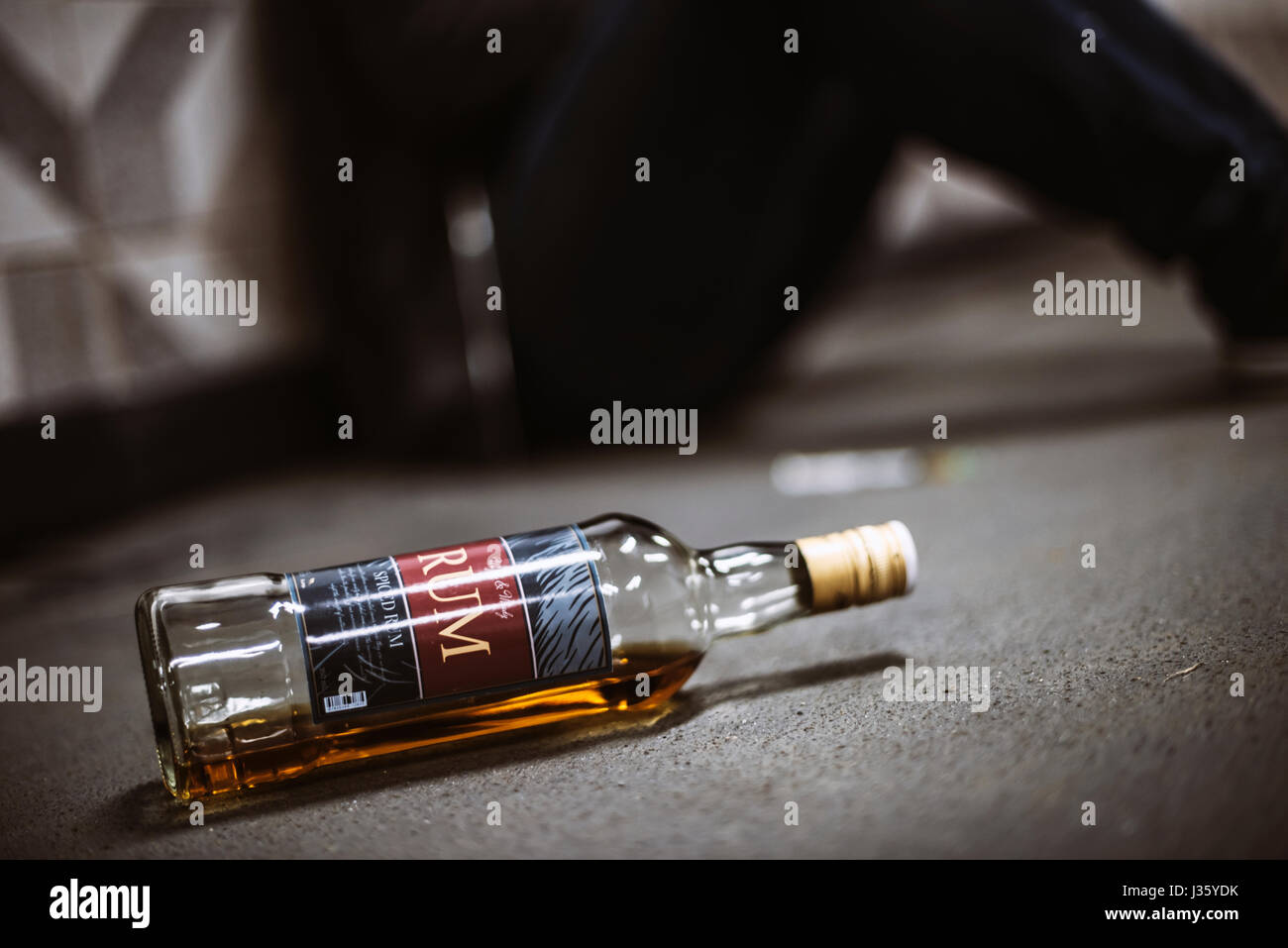 Liquor Alcohol Bottle Lying on The Floor Stock Photo - Alamy