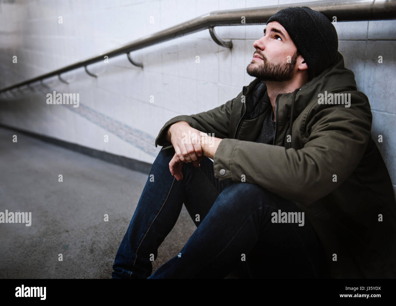 Adult Man Sitting Hopeless on The Floor Stock Photo - Alamy
