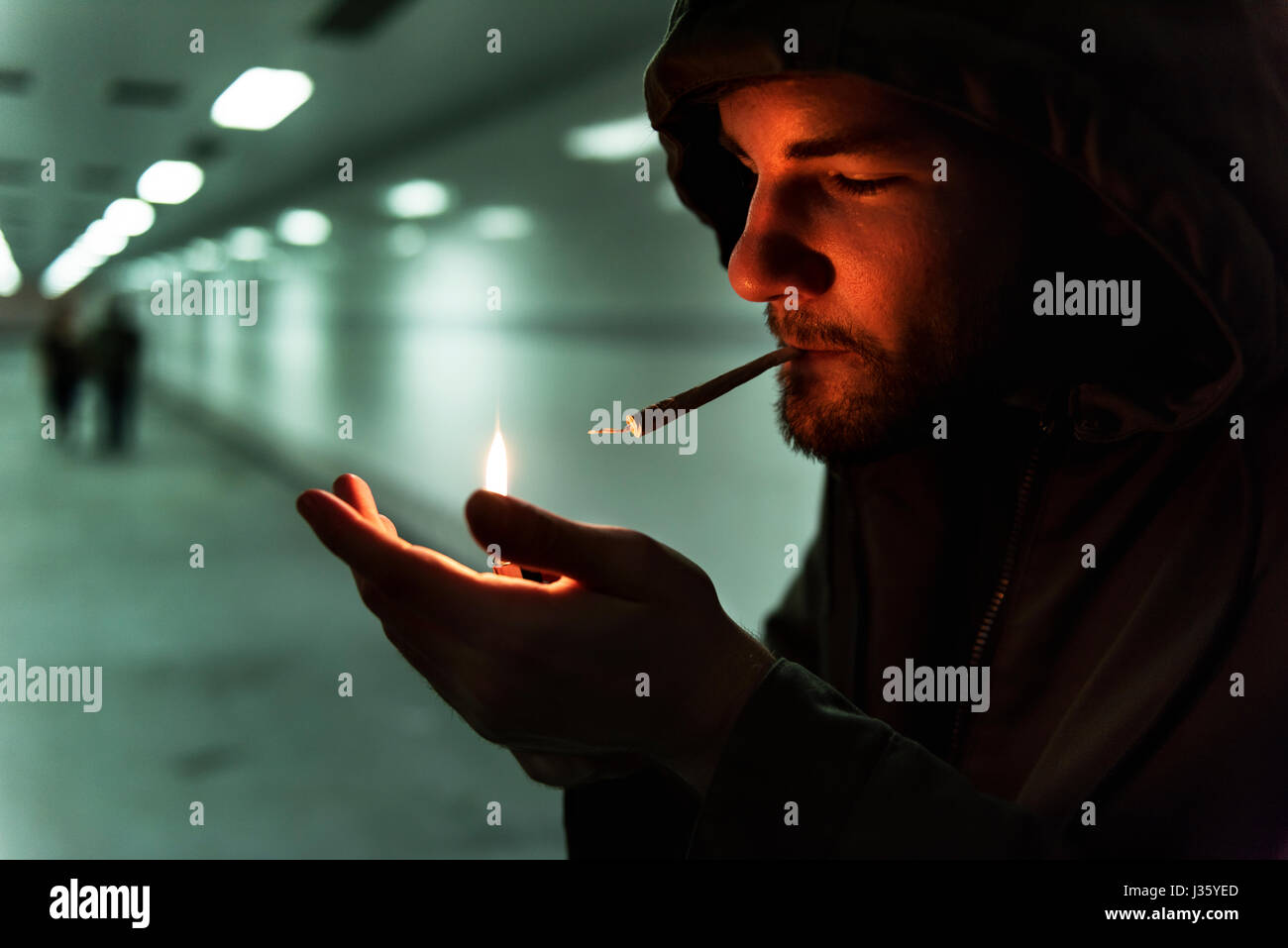 Homeless Adult Man Lightening Up Cigarette Addiction Stock Photo - Alamy