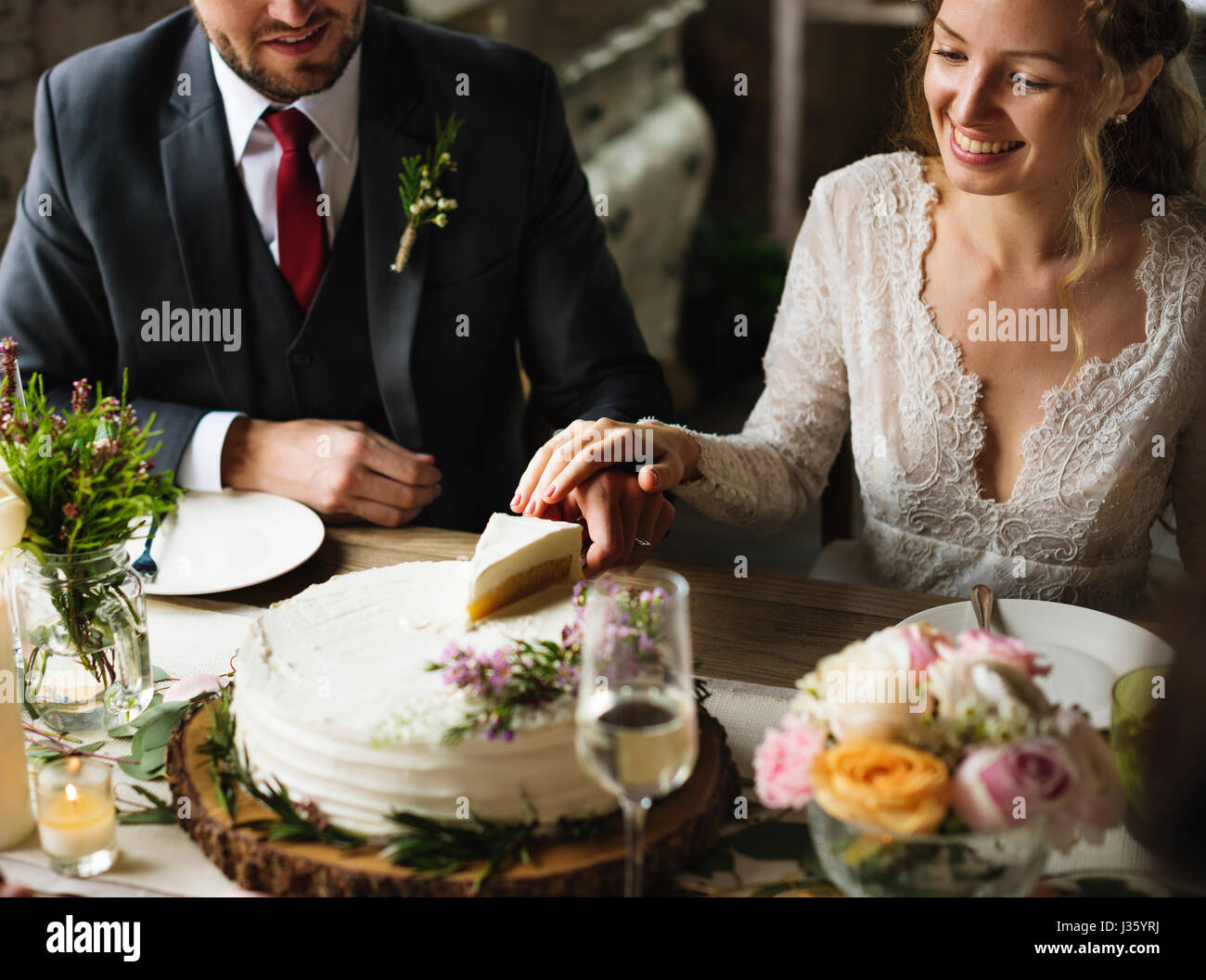 Bride and Groom Cutting Cake on Wedding Reception Stock Photo - Alamy