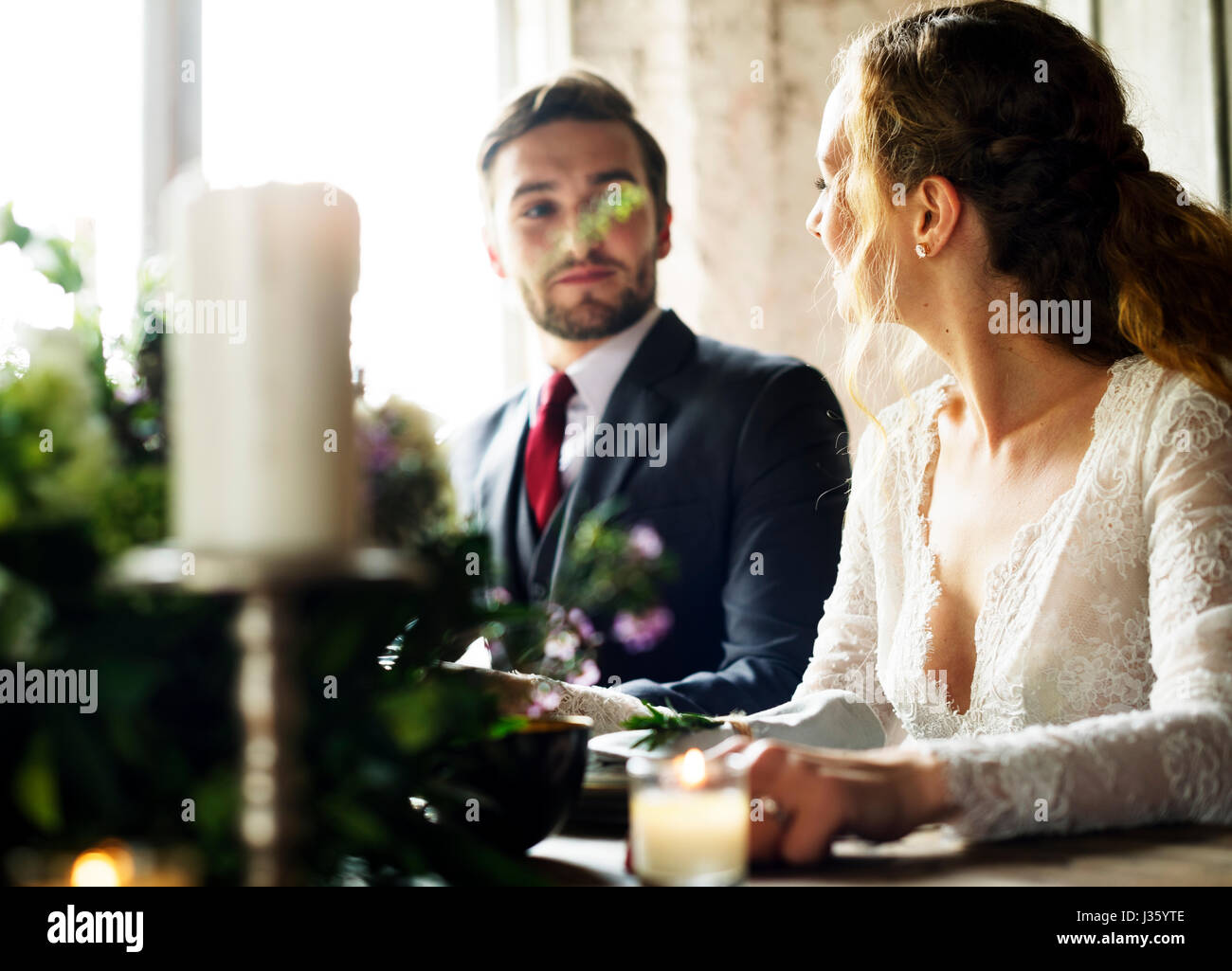 Bride and Groom Having Meal with Friends at Wedding Reception Stock ...