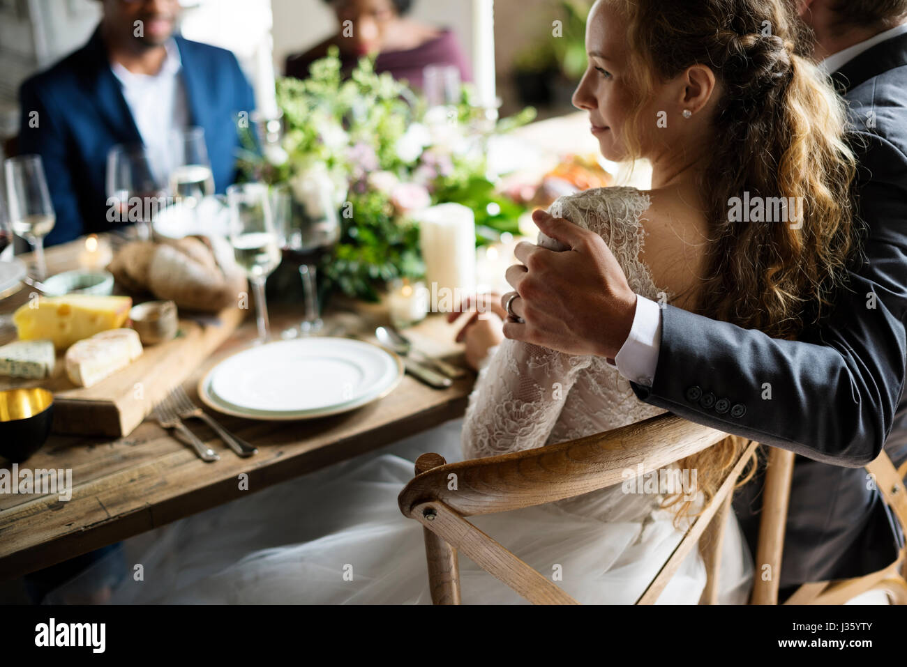 Bride and Groom Having Meal with Friends at Wedding Reception Stock ...