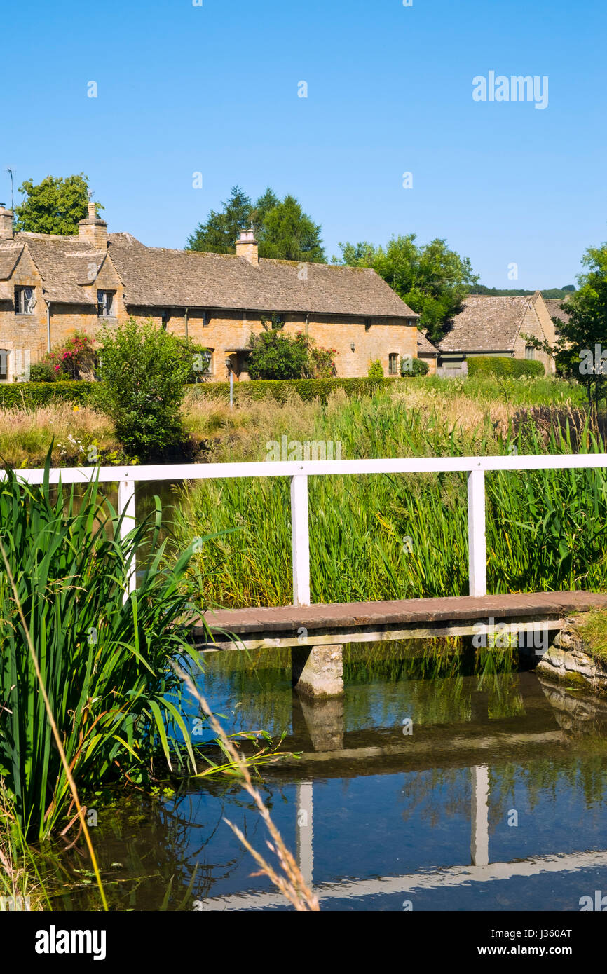 Summer sunshine in idyllic Lower Slaughter village in the Cotswolds ...