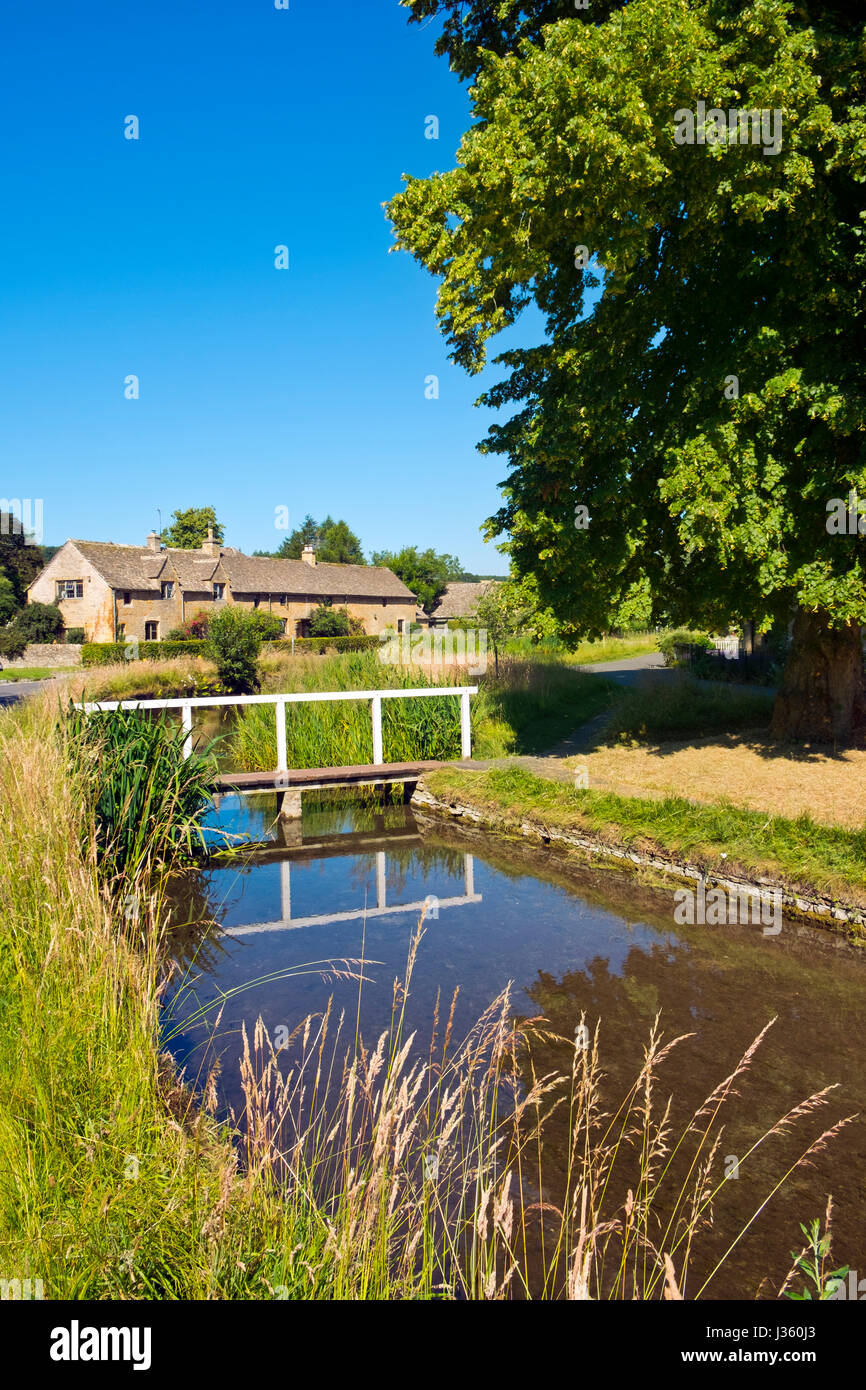 Summer sunshine in idyllic Lower Slaughter village in the Cotswolds ...