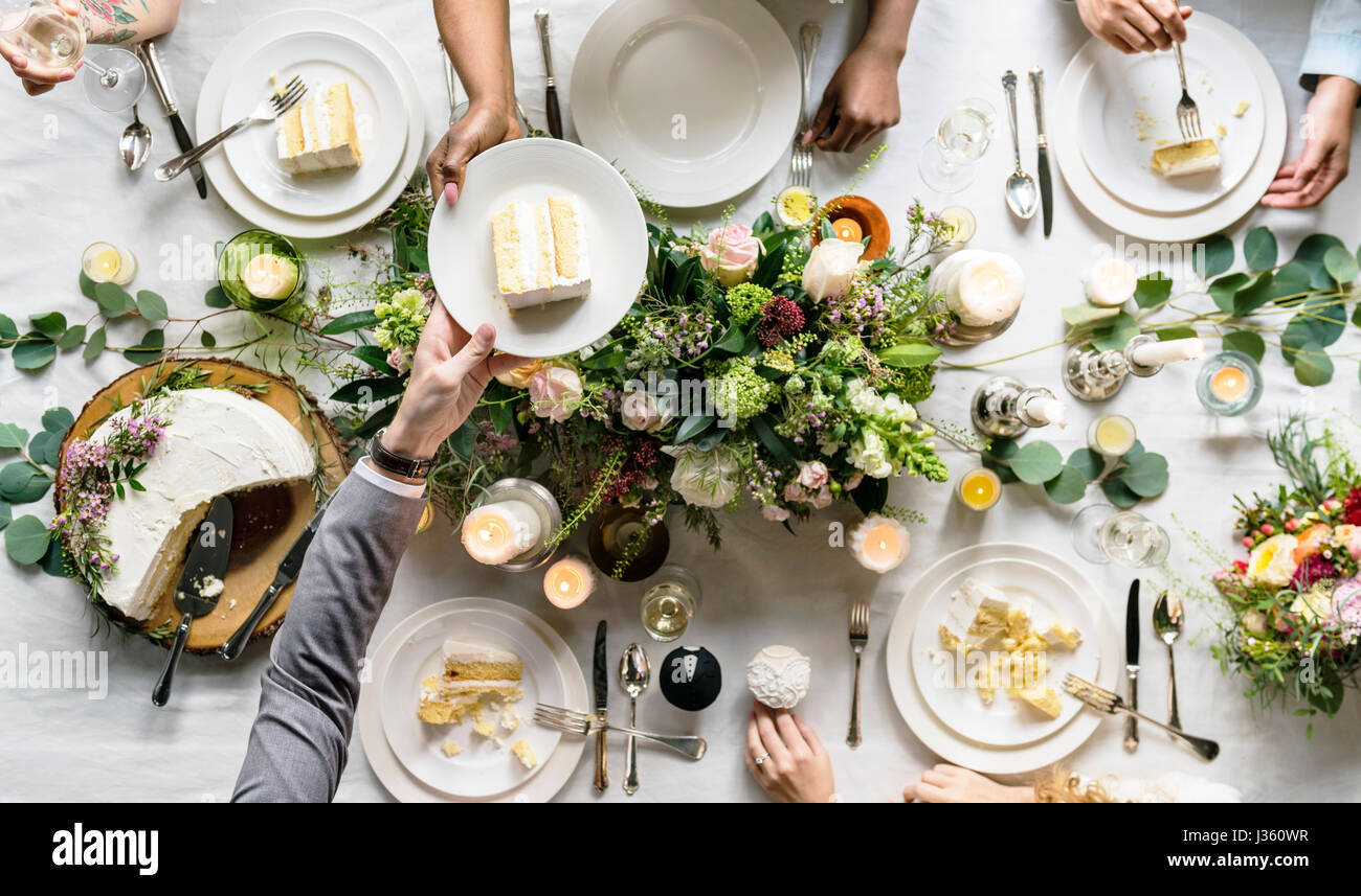 Groom Handing Cake to Friends on Wedding Reception Stock Photo - Alamy