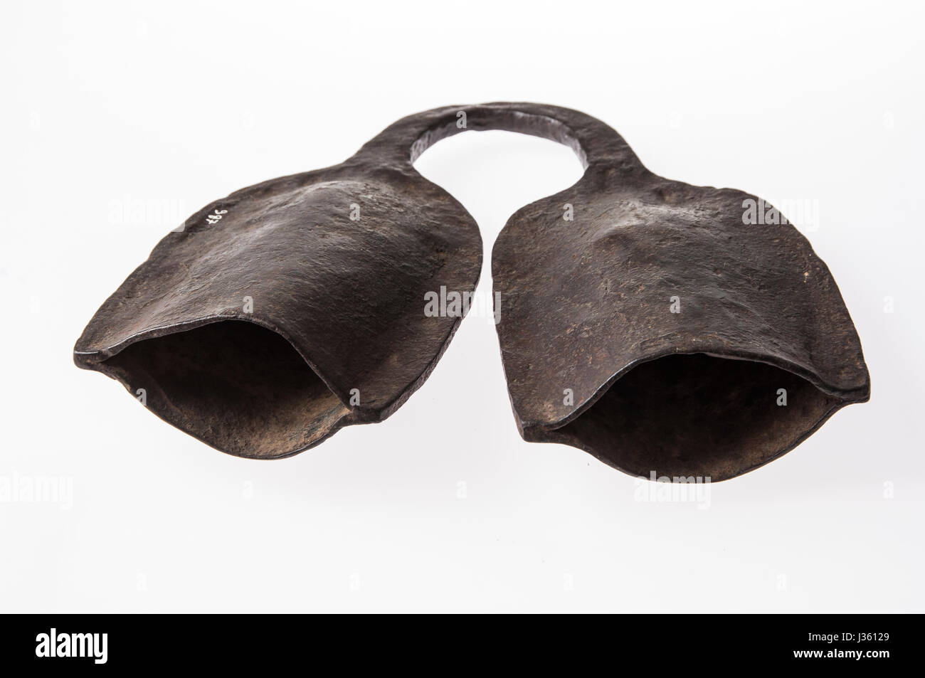 African instrument made by hand, brass, kind of bell, isolated on white ...