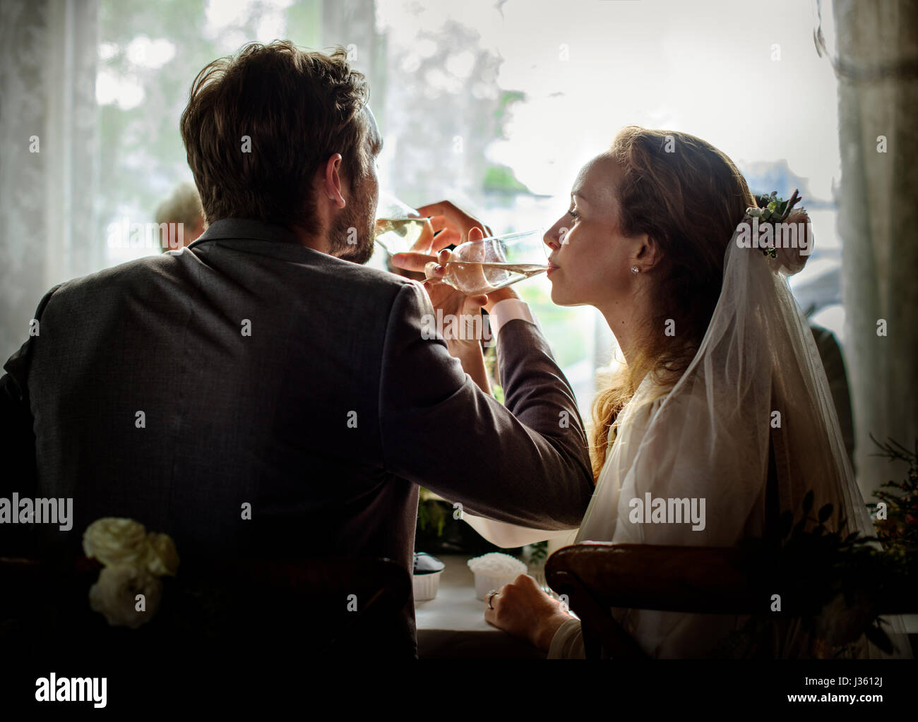 Bride and Groom Drinking Wine Together at Wedding Reception Stock Photo ...