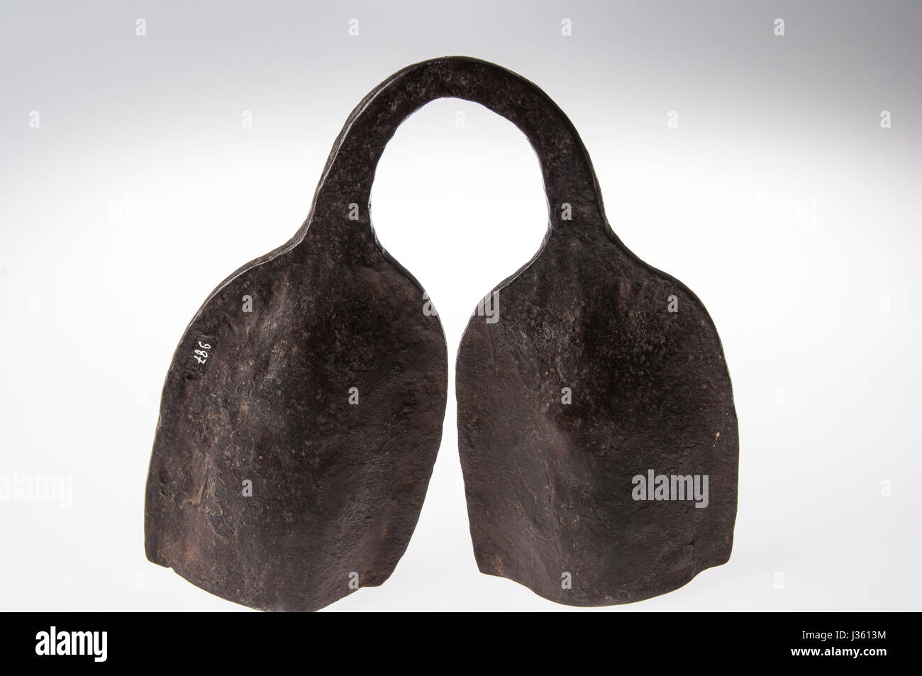 African instrument made by hand, brass, kind of bell, isolated on white ...